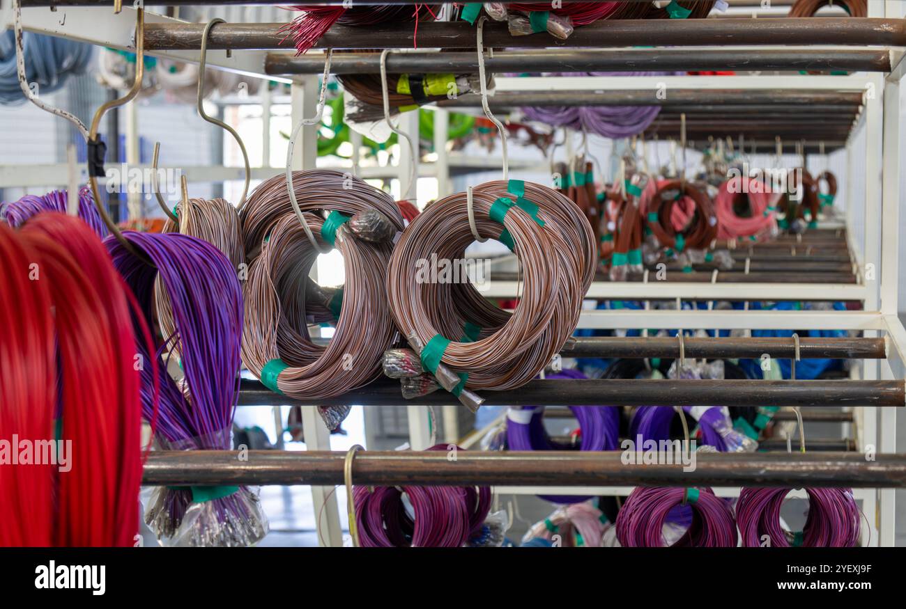 shelf and rack with wires and cables in an car wire harness factory ...