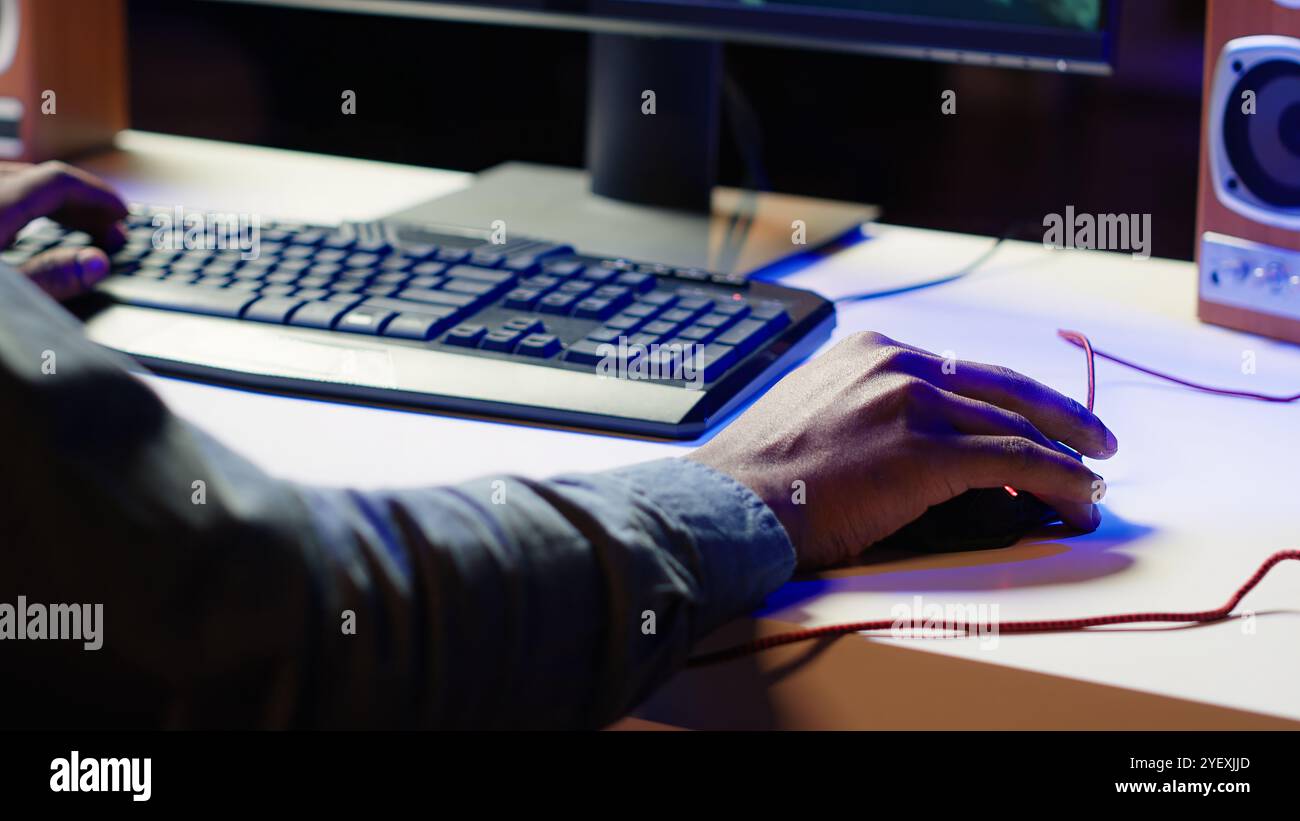 Keyboard and mouse used by gamer competing in online multiplayer ...