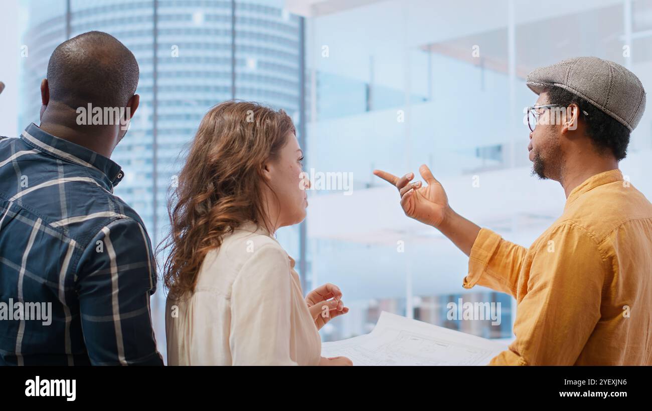 Business team and a real estate agent strategizing the relocation of a ...