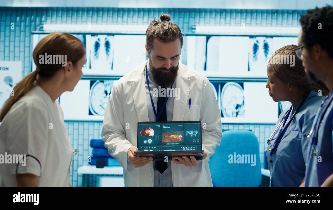 Professional medic analyzing mri brain scan with his staff in medical ...