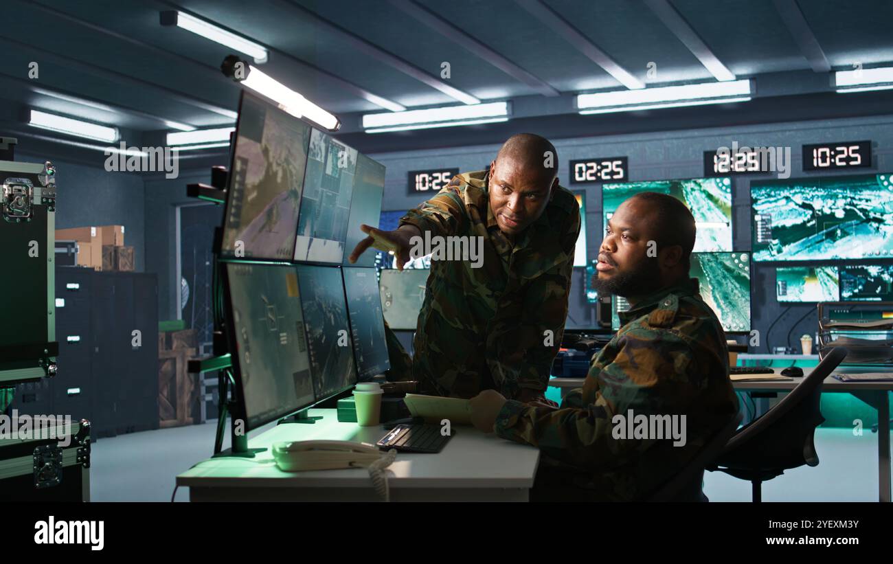 Military officers look at intel folder files on enemy battle formation, comparing with radar ...