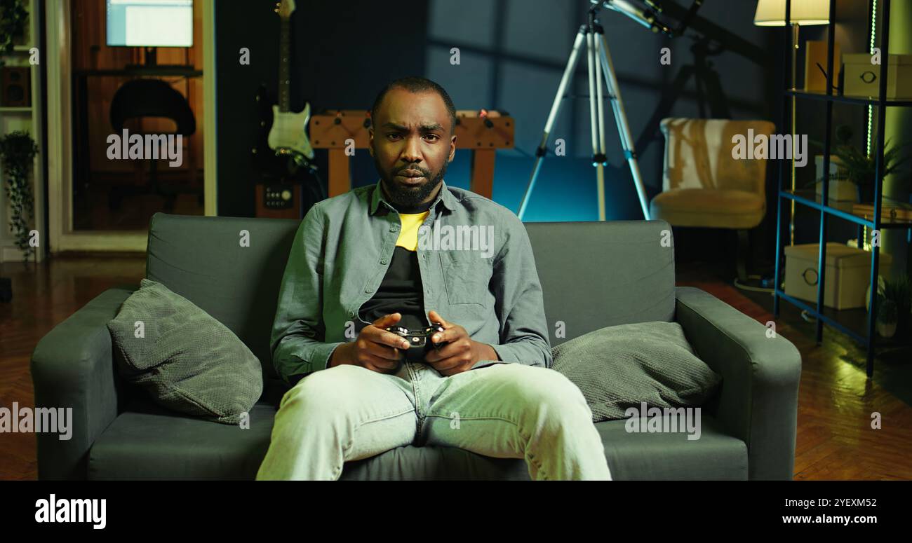 Focused gamer in rgb lit hi-res stock photography and images - Alamy