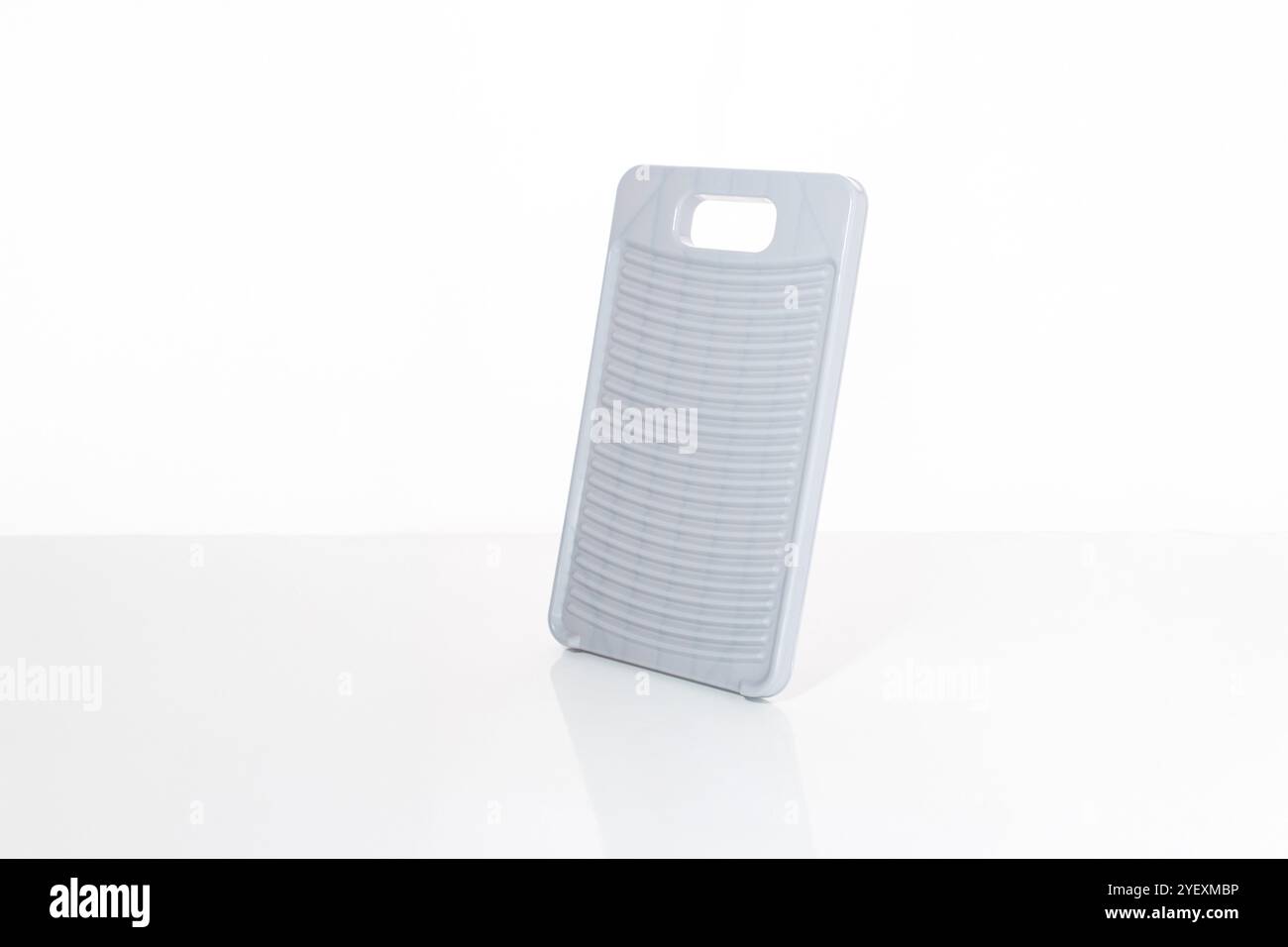 Gray plastic washboard, upright position, flat surface, white ...