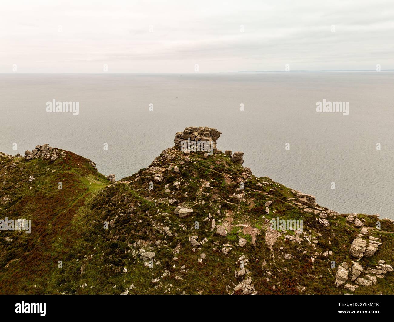 Aerial view of a valley between cliffs covered in vegetation ...