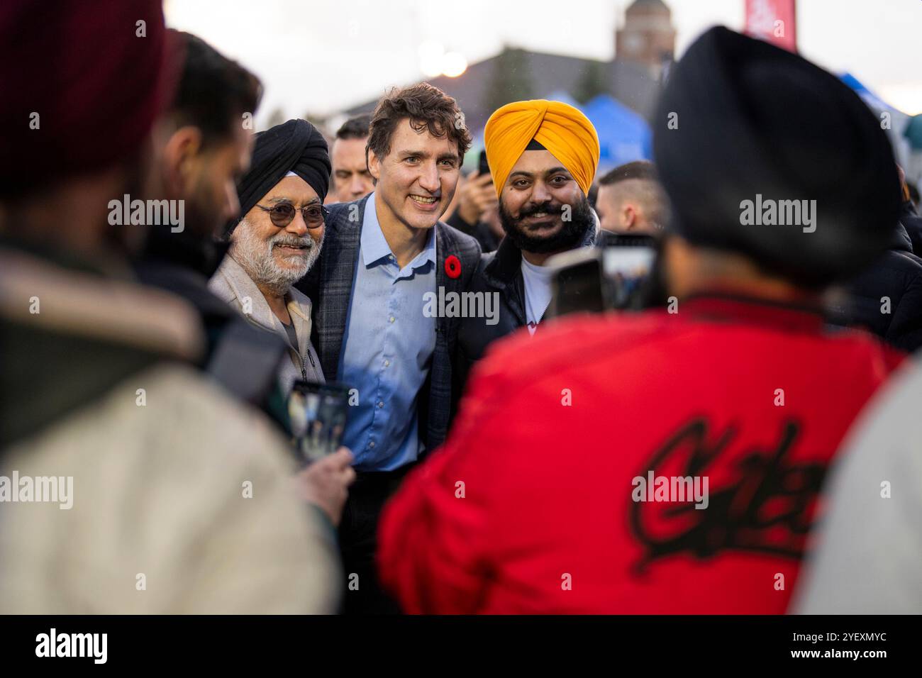 Canada Prime Minister Justin Trudeau poses for photos with fans as he ...