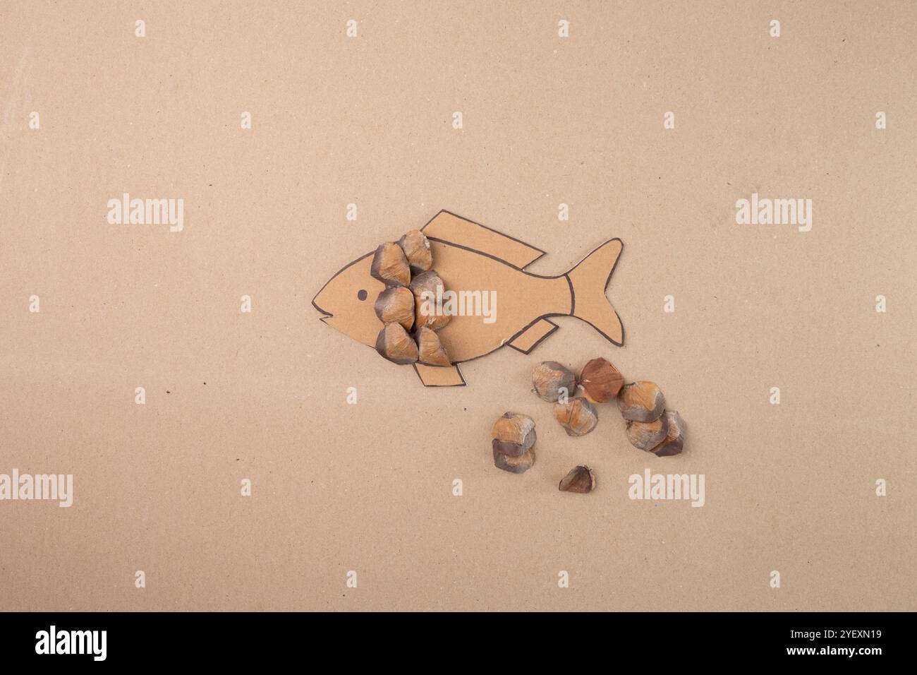 process of making a fish shaped craft using pine cones seed scales, and ...