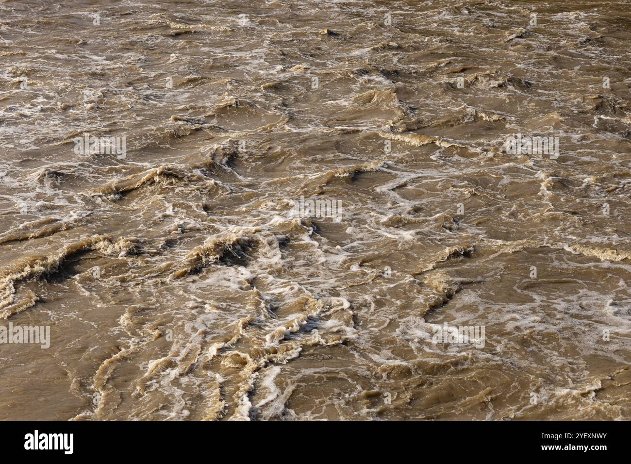 Powerful rushing water with turbulent flow after heavy rainfall ...