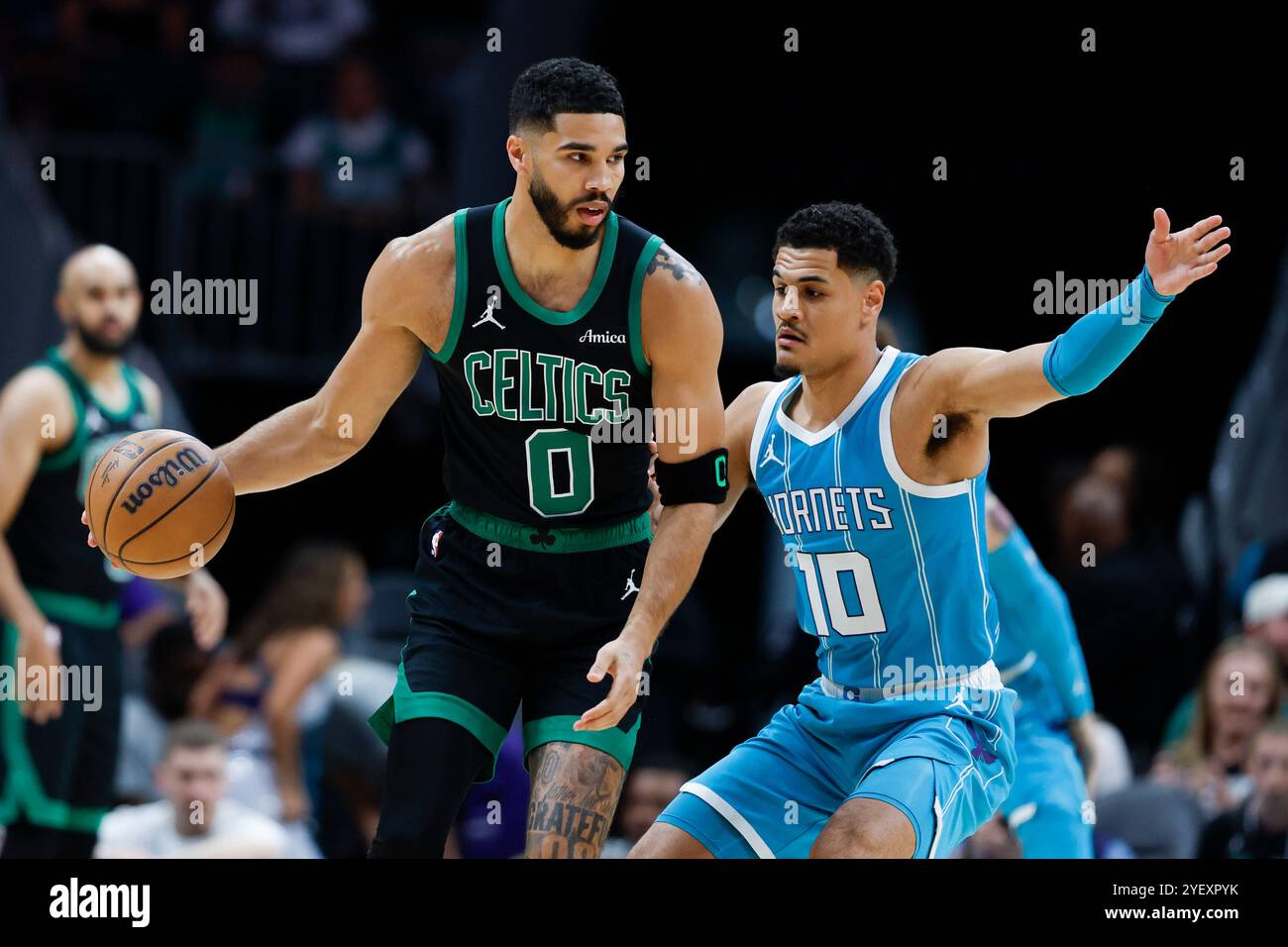 Boston Celtics forward Jayson Tatum (0) looks to pass against Charlotte ...