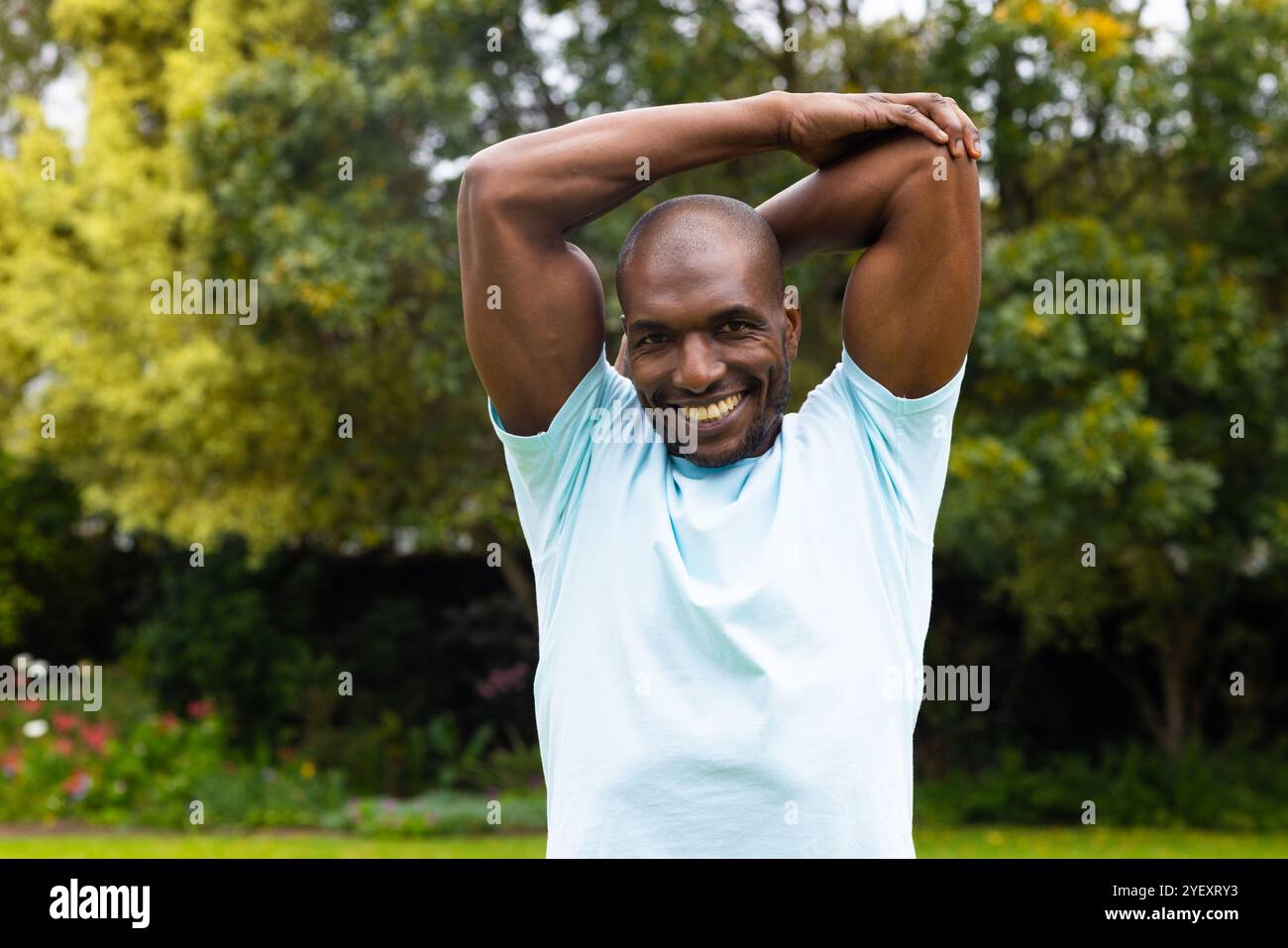 Smiling man stretching arms hi-res stock photography and images - Alamy