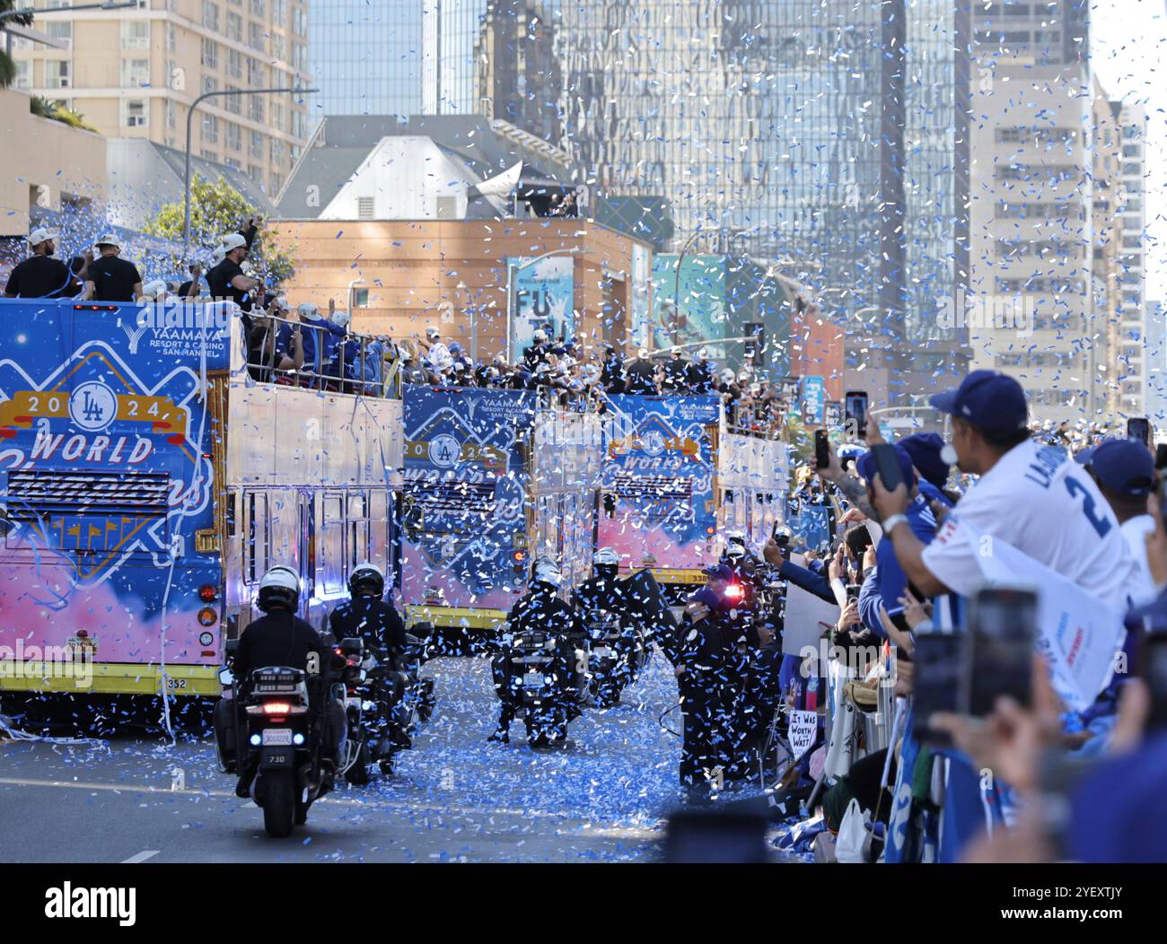 Los Angeles Dodgers players and coaches are paraded on buses during ...