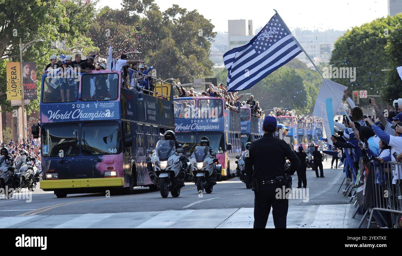 Los Angeles Dodgers players and coaches are paraded on buses during ...