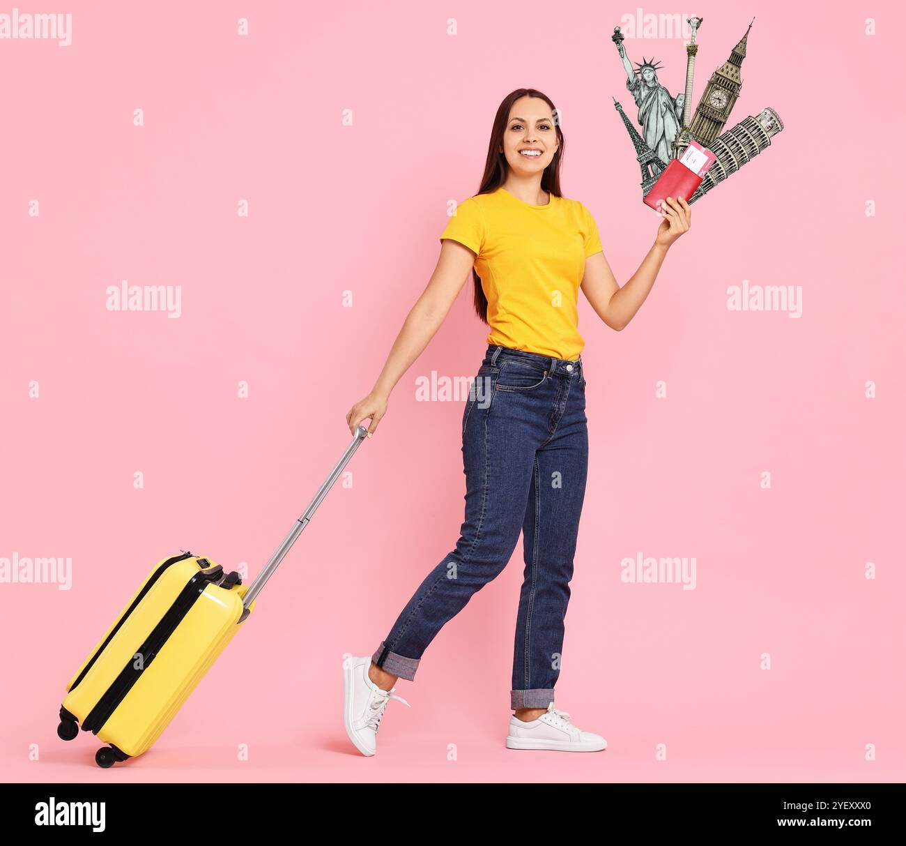Happy traveler with suitcase, passport and ticket on pink background ...