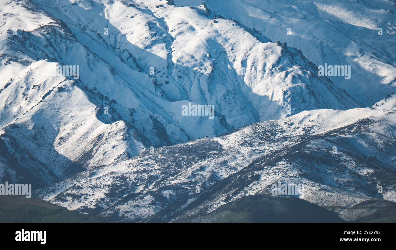 Snow covered mountains close up in Alexandra new Zealand iconic scenery ...
