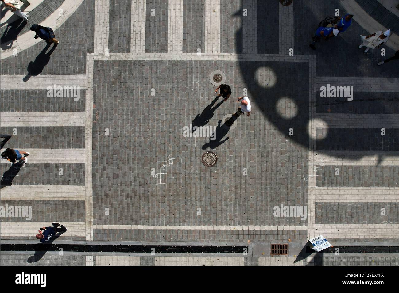 People walk through an intersection in downtown Miami, Friday, Nov. 1 ...