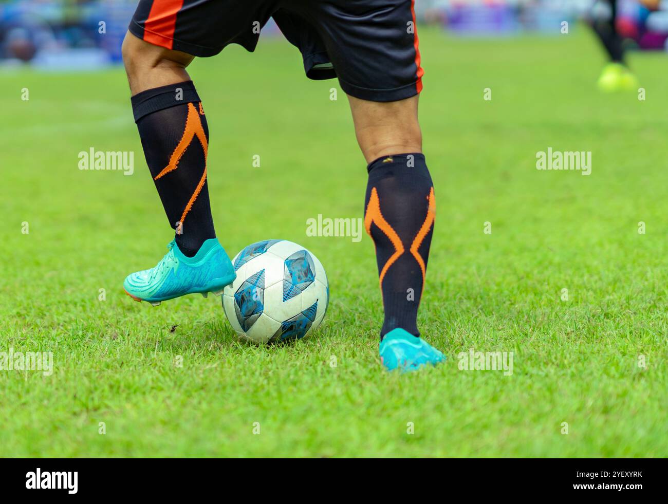Soccer player prepares to strike soccer ball with his cleat on stadium ...