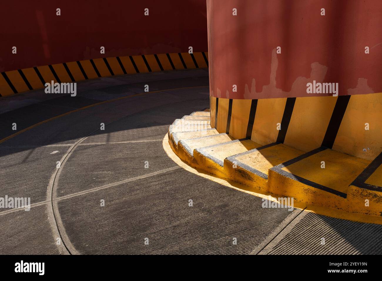 Curved Parking Garage Ramp with Yellow and Black Stripes Stock Photo ...
