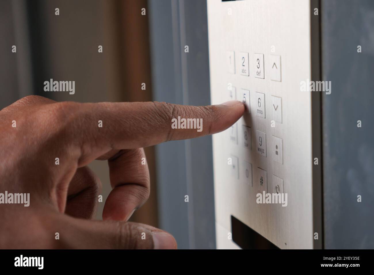 The man push lift button down Stock Photo - Alamy