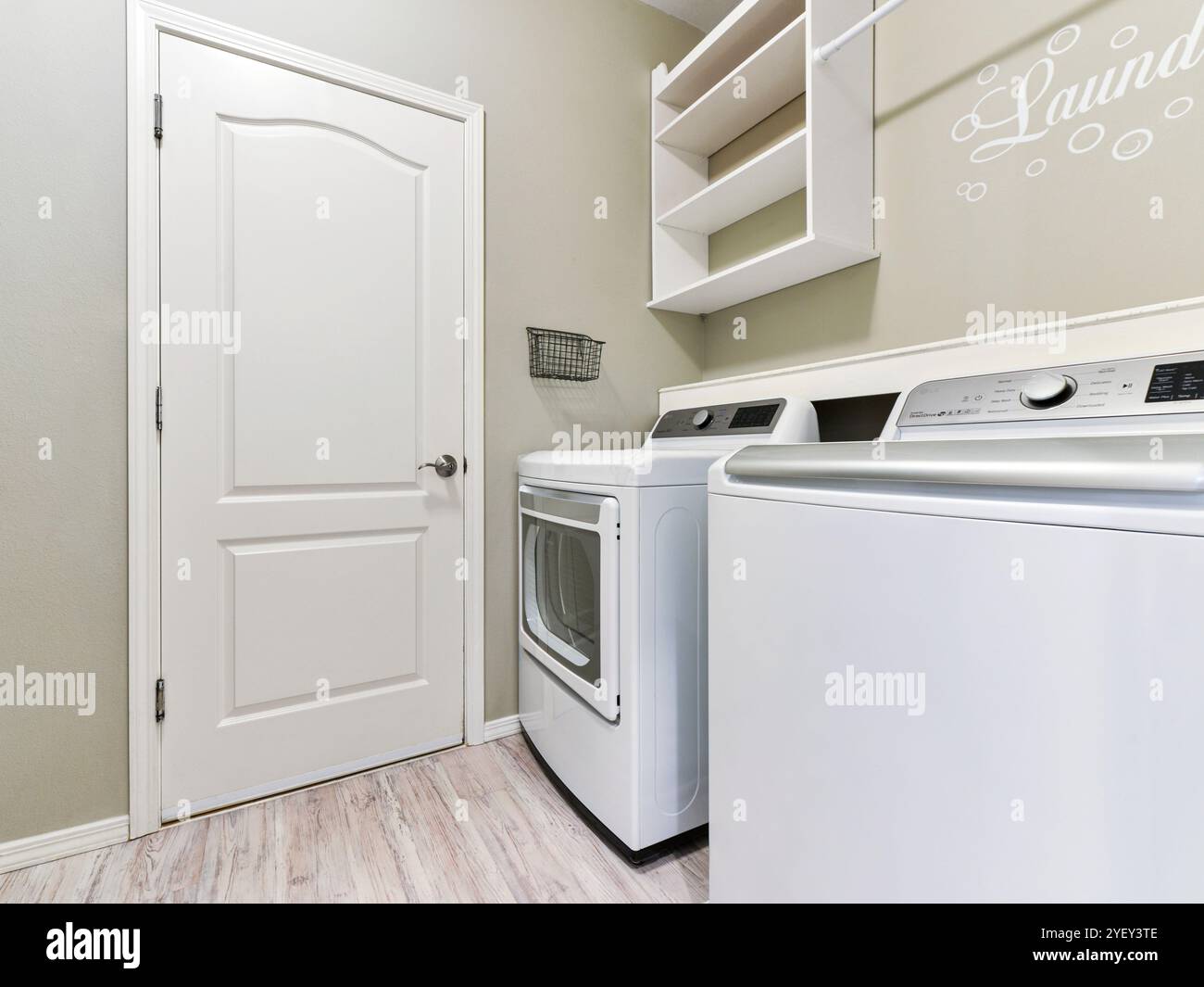 Modern residential laundry room interior Stock Photo - Alamy
