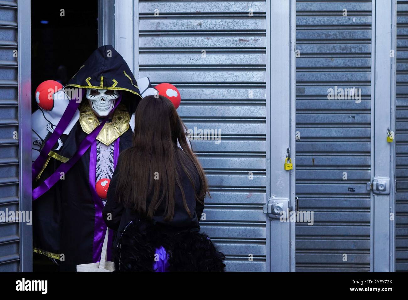 November 1, 2024, Santiago, Metropolitana, Chile: A woman fixes a ...