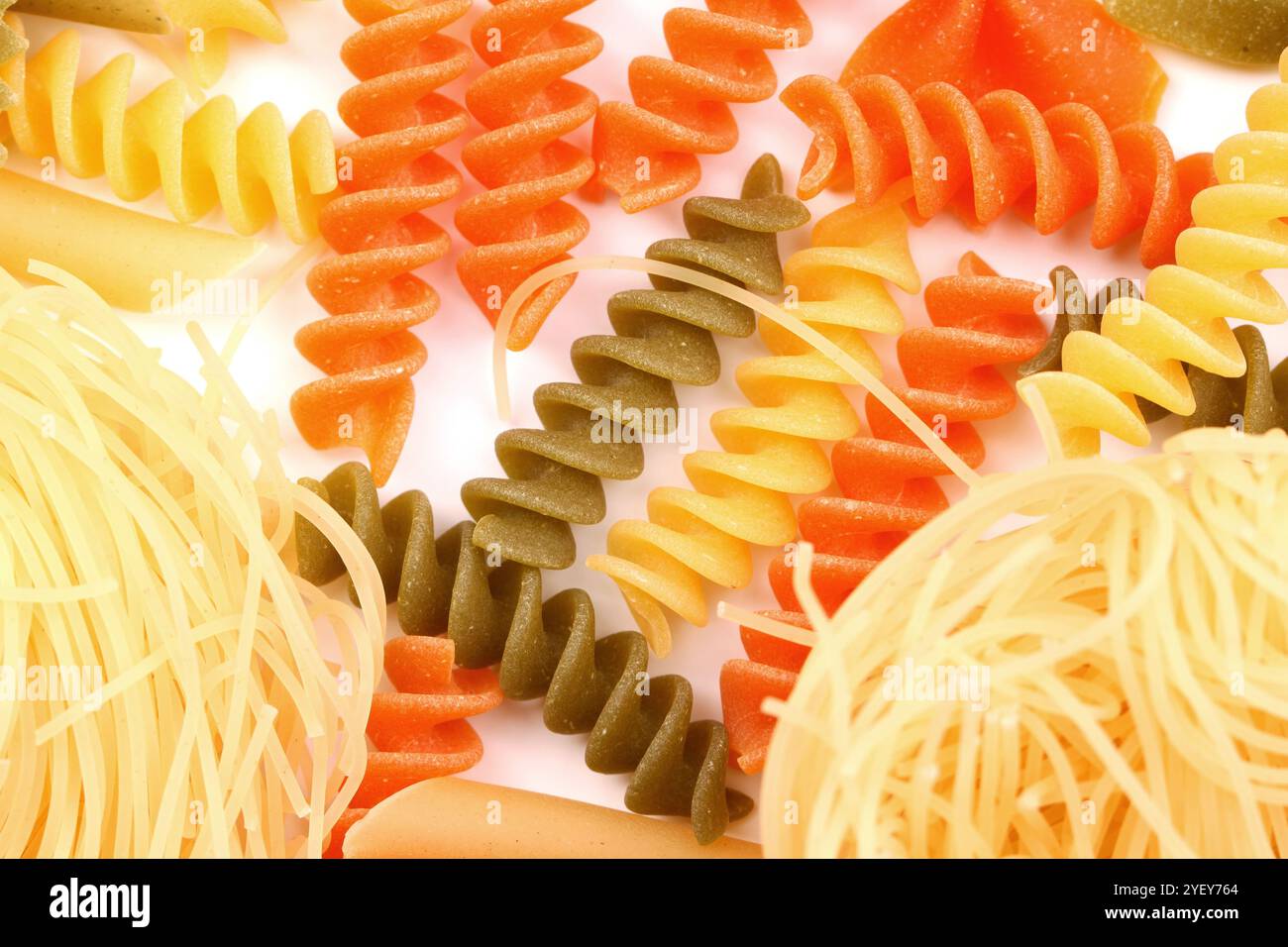 different pasta in three colors close-up on the white background Stock ...