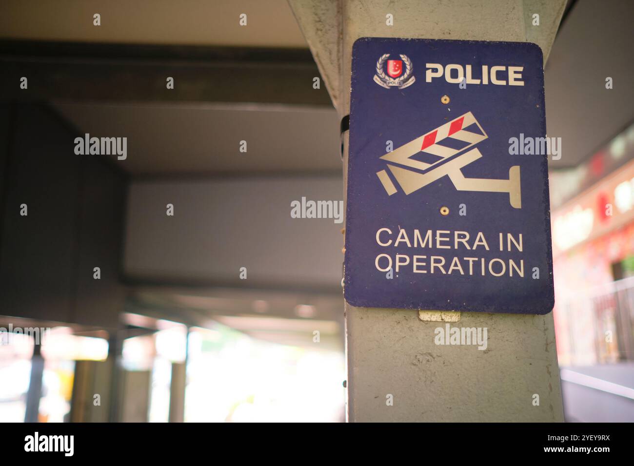 Singapore police camera in operation sign at bus stop Stock Photo - Alamy