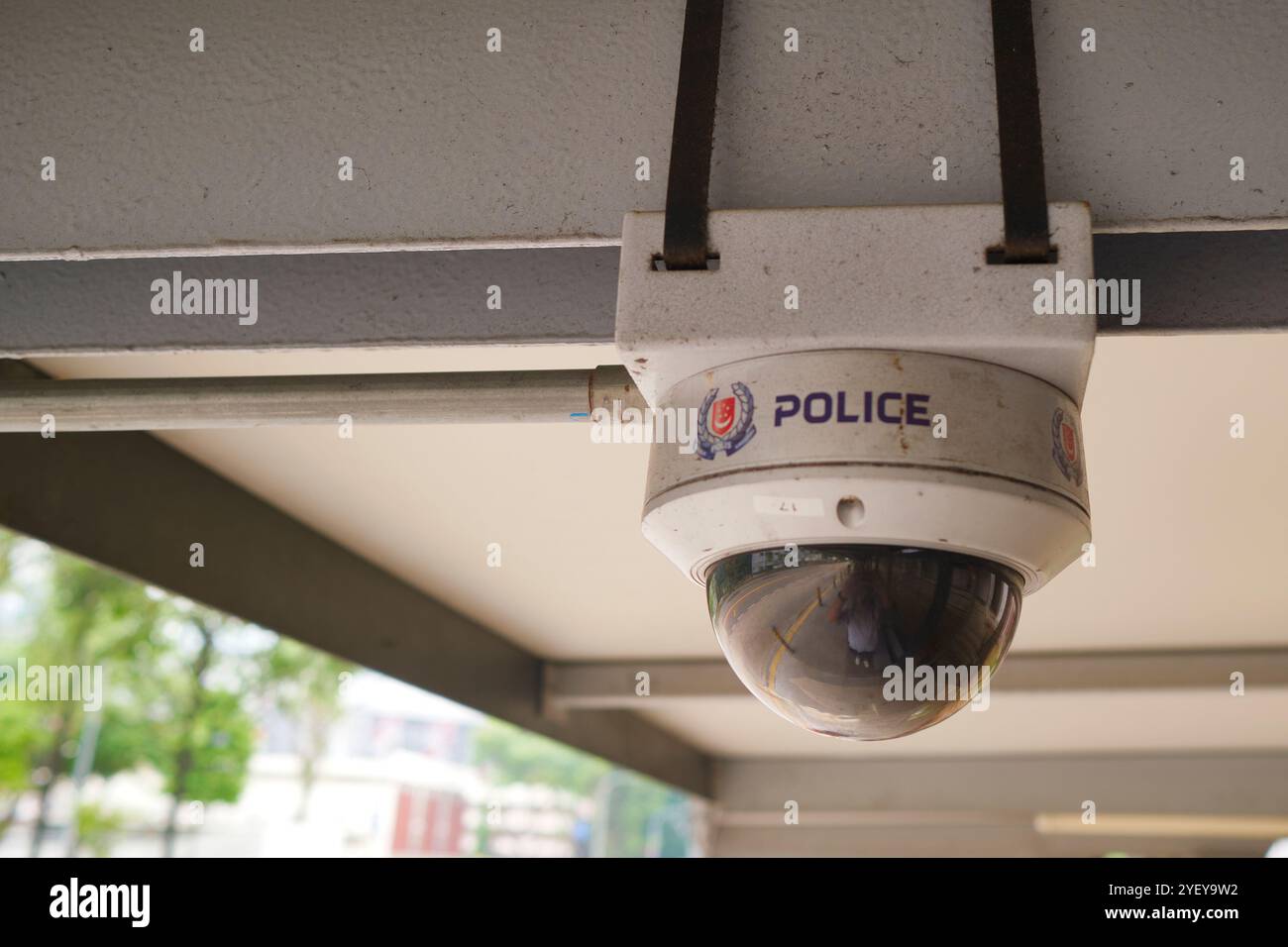 Singapore police CCTV at bus stop Stock Photo - Alamy