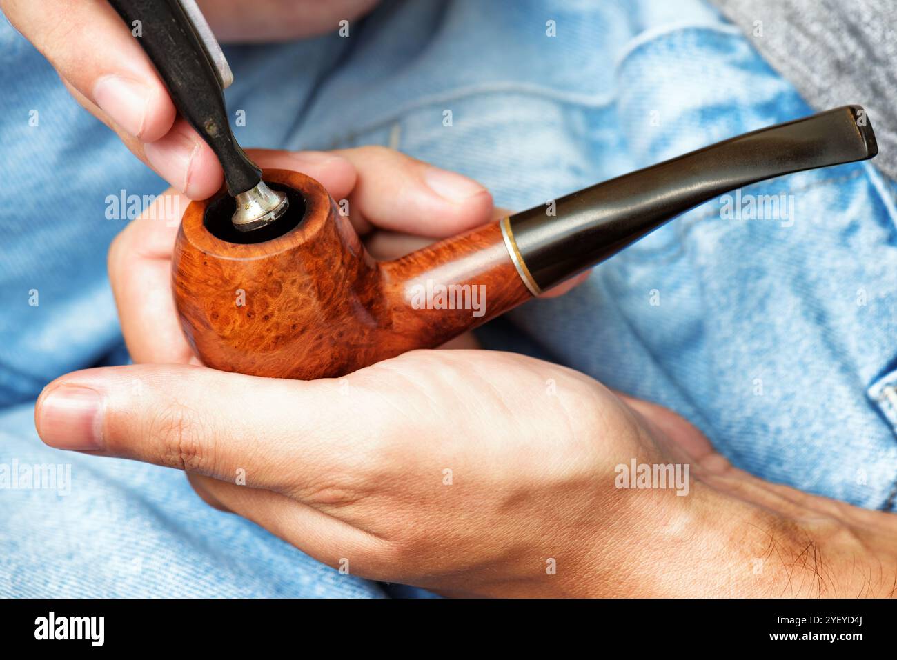 Hand holding pipe hi-res stock photography and images - Alamy