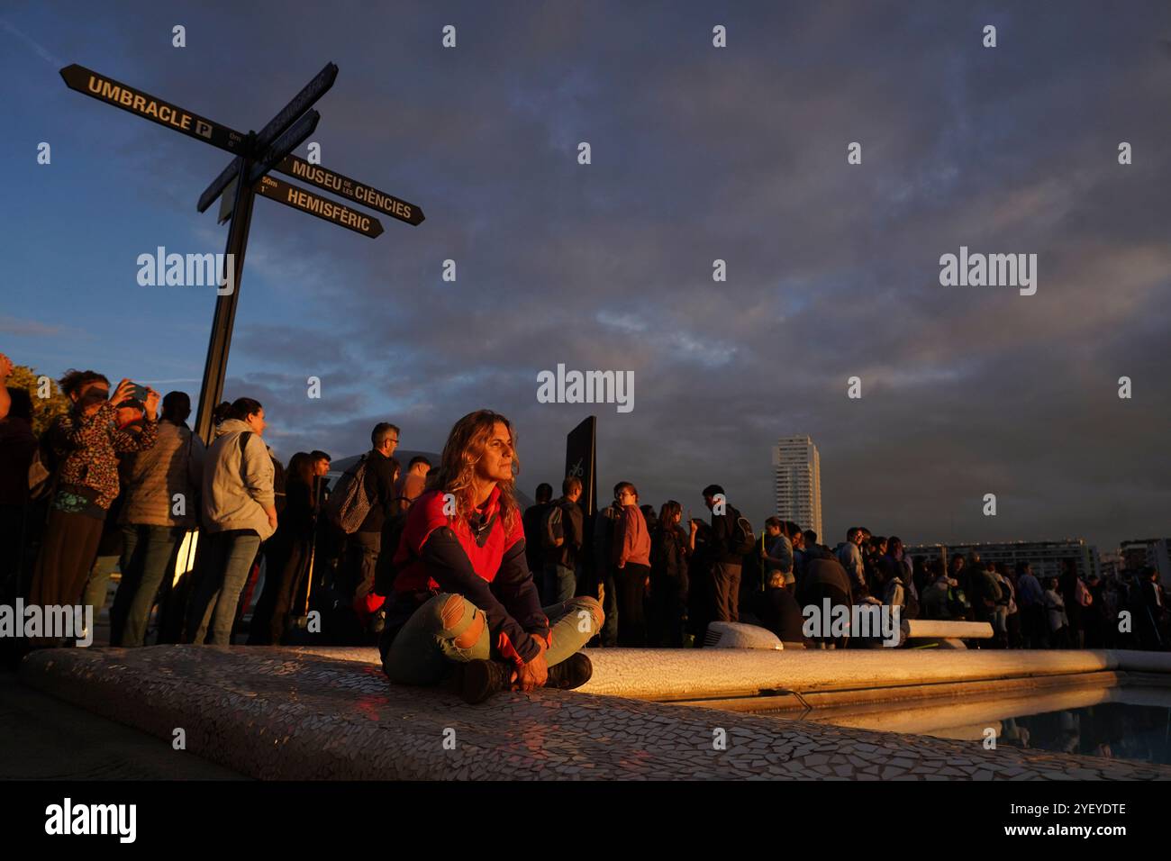 Volunteers wait after thousands showed up to be assigned work schedules ...