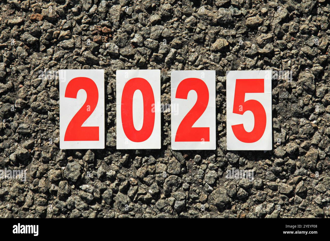 Numbers of 2025 year. Paper square numbers on the stone road background ...