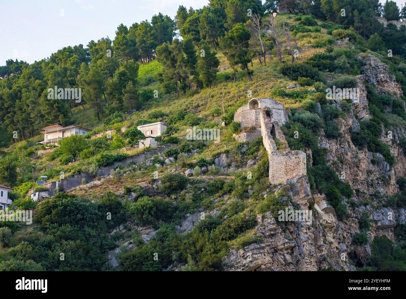 A section of the fortified walls of Berat Castle, Albania. A blend of ...