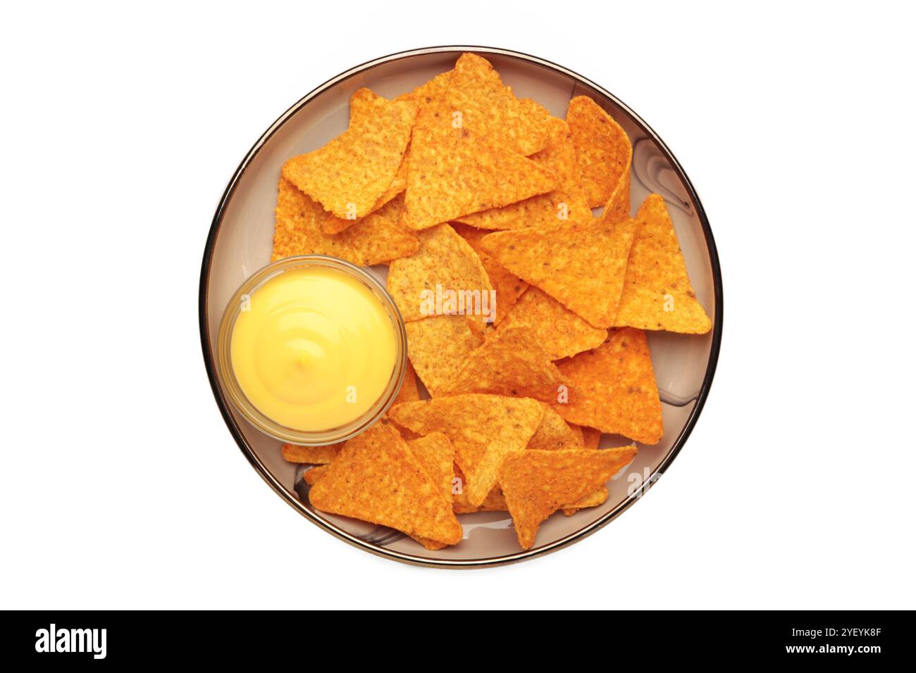 Tasty nachos with cheese sauce isolated on white background. Top view ...