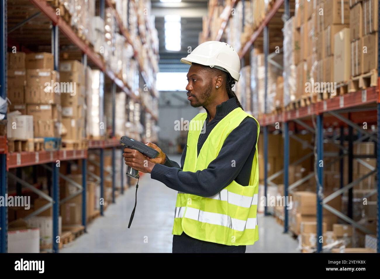 Warehouse worker scanning shipping boxes hi-res stock photography and ...