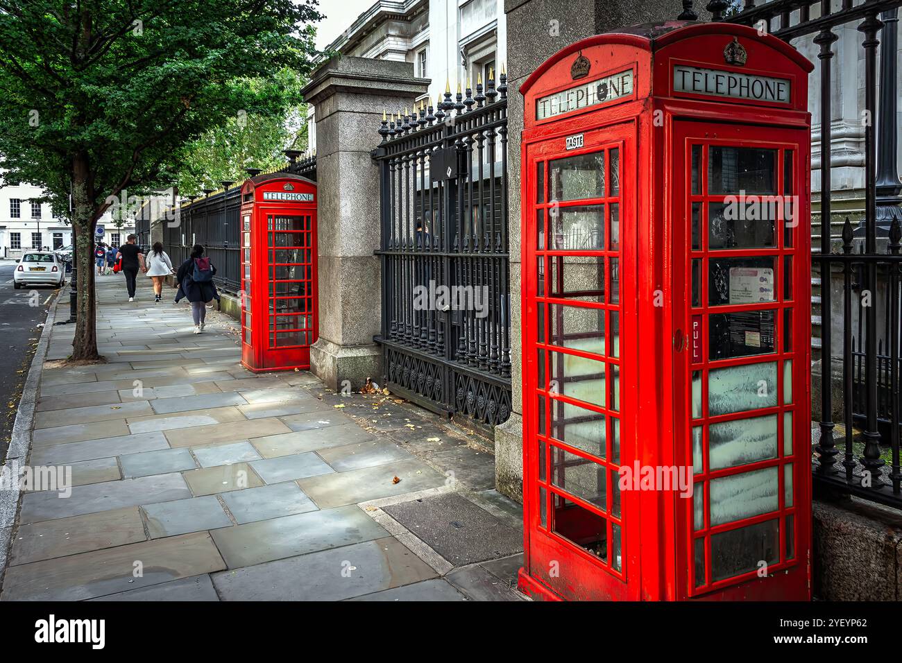 Typical red English telephone boxes in front of the British Museum. London, England, Europe ...