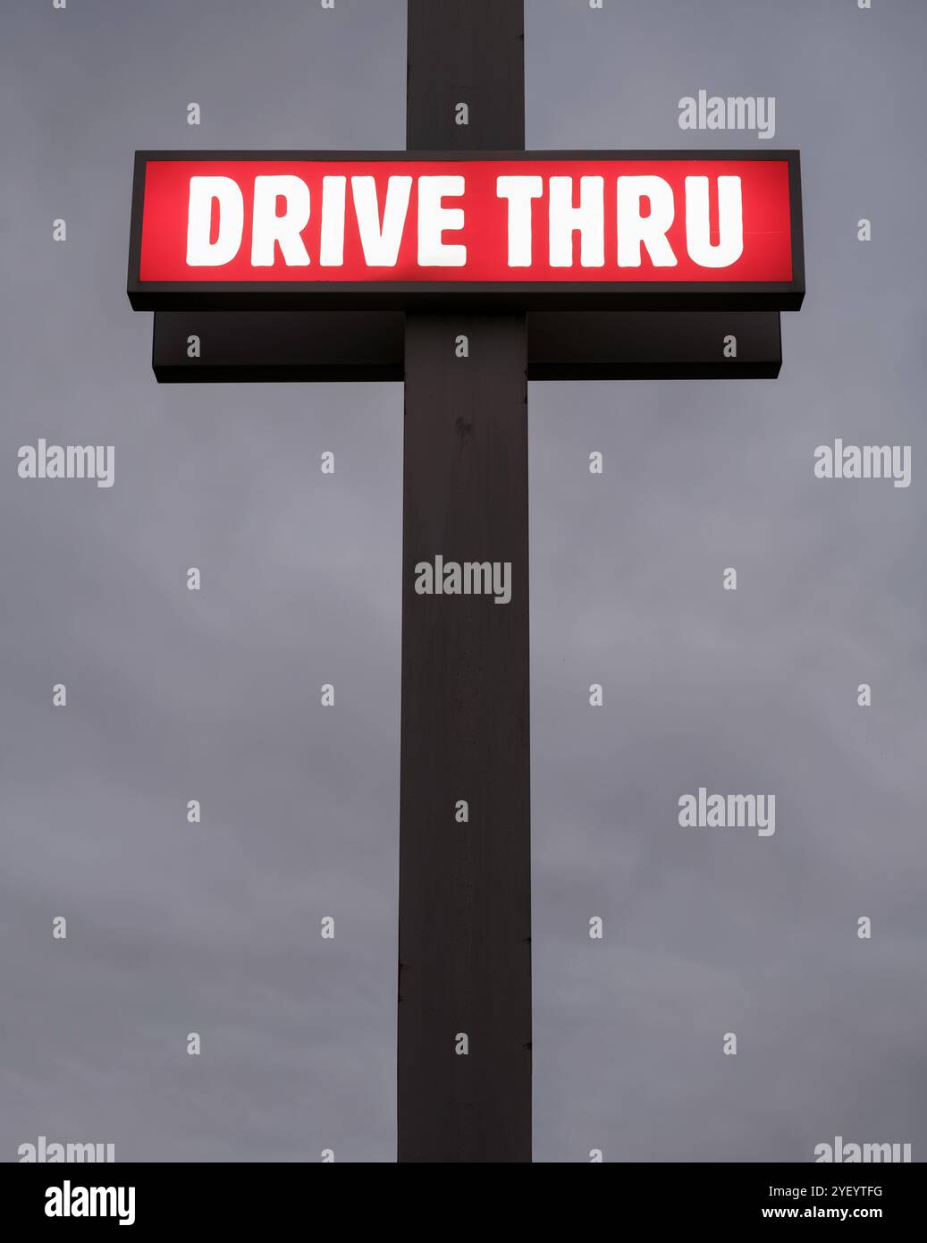 A Vibrant Red Sign Advertising Drive-Through (Drive-Thru) Fast Food ...