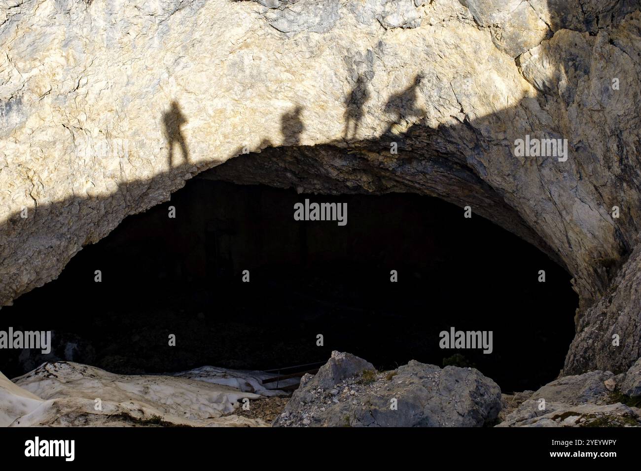 Shadow of cave rescuers on the rock above the cave entrance of the ...