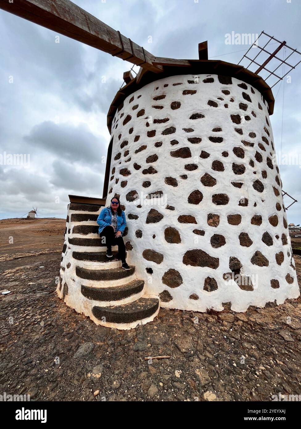 woman sitting on windmill stairs Stock Photo - Alamy