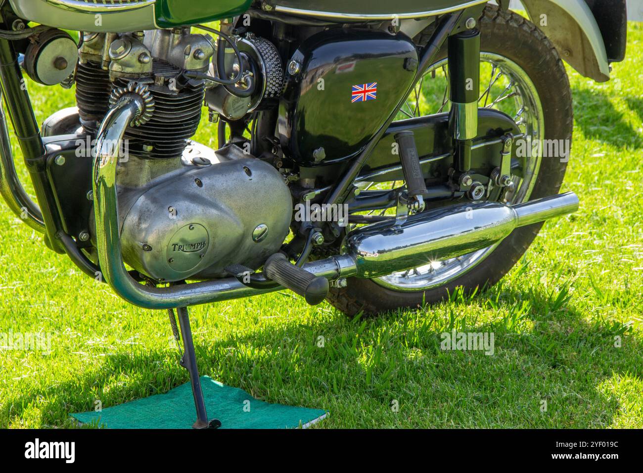 Close up showcasing the engine, exhaust, and union jack emblem of a ...