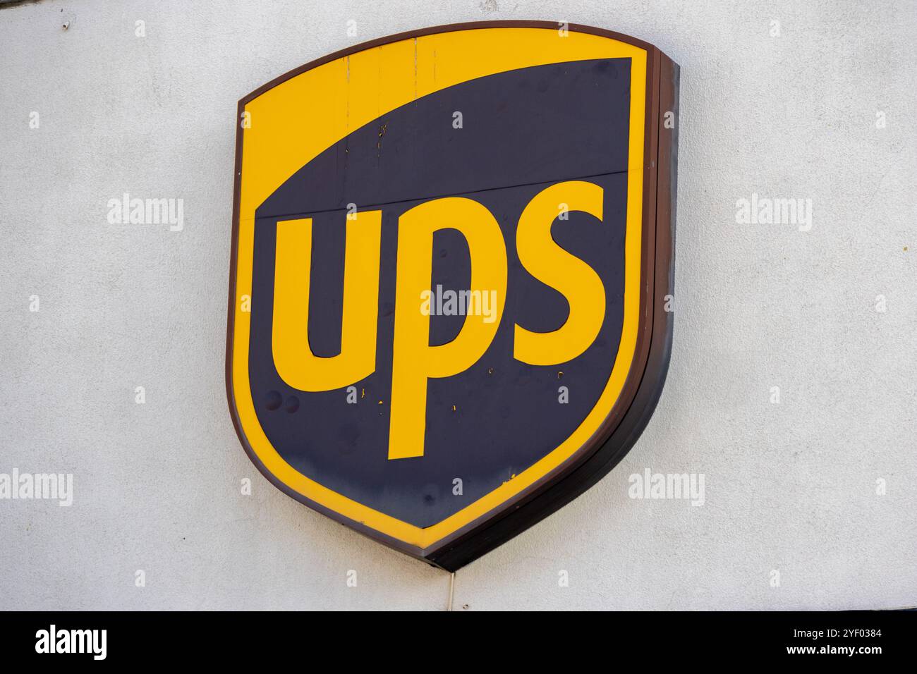 Ups logo displayed on a building facade representing global shipping ...