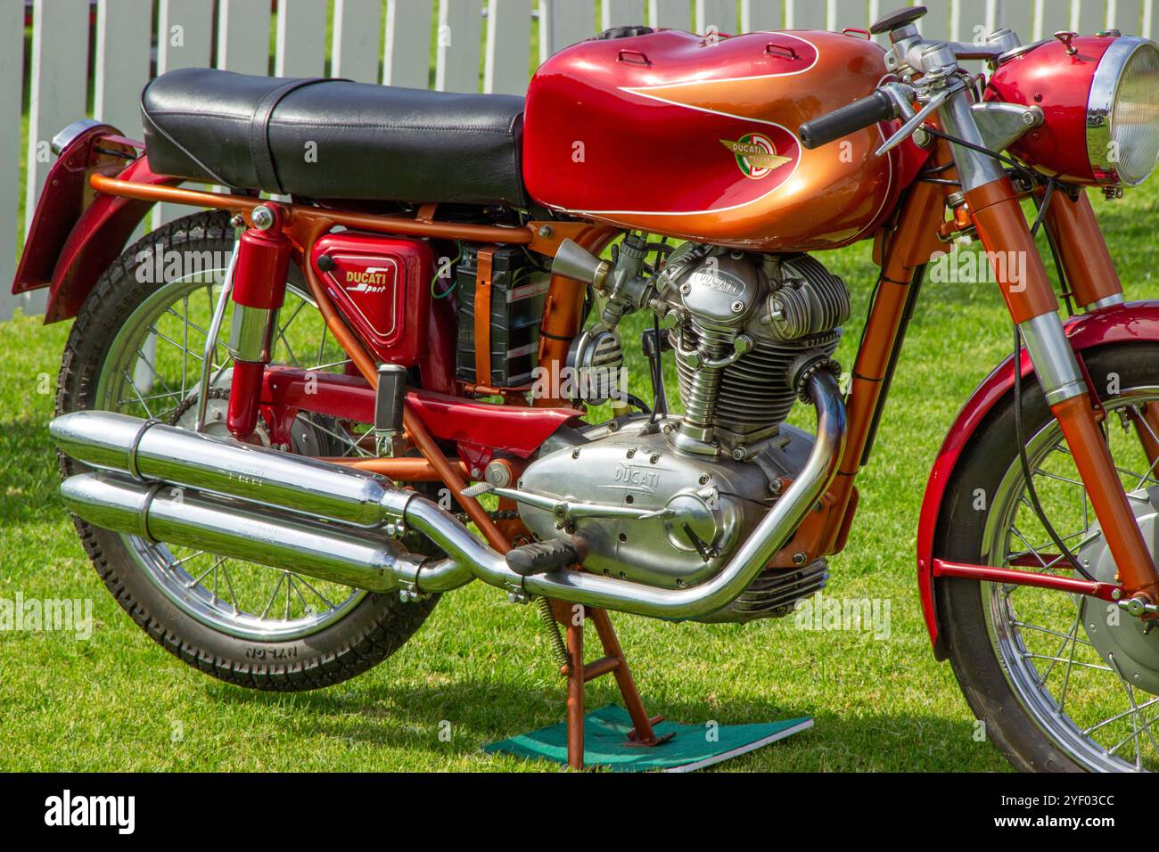 Gleaming vintage ducati 250 mach 1 motorcycle parked on a grassy field ...