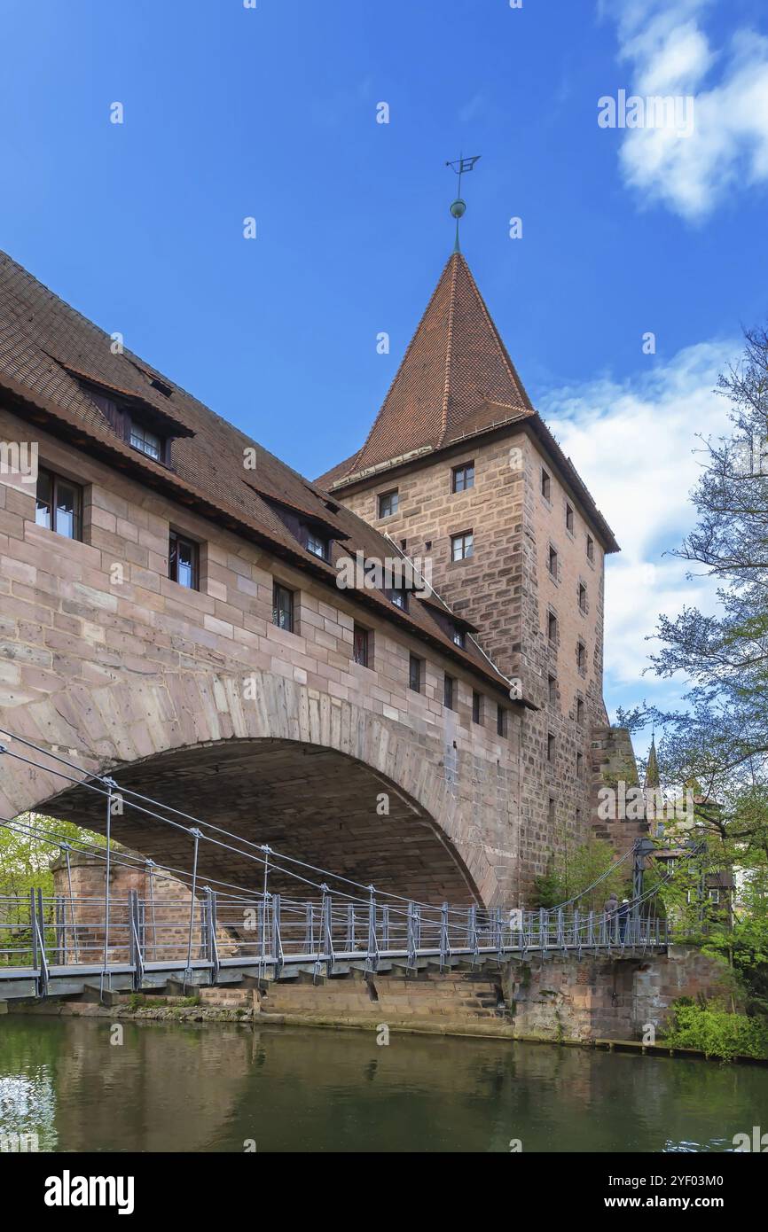 Pedestrian chain bridge (Kettensteg) and the medieval city wall behind ...