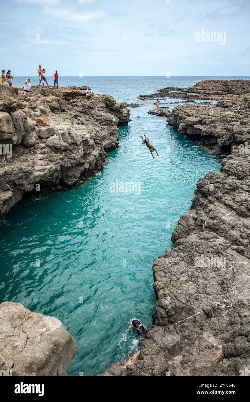 Dive into the ocean in a small cove near Palmeira, Sal, Cape Verde ...