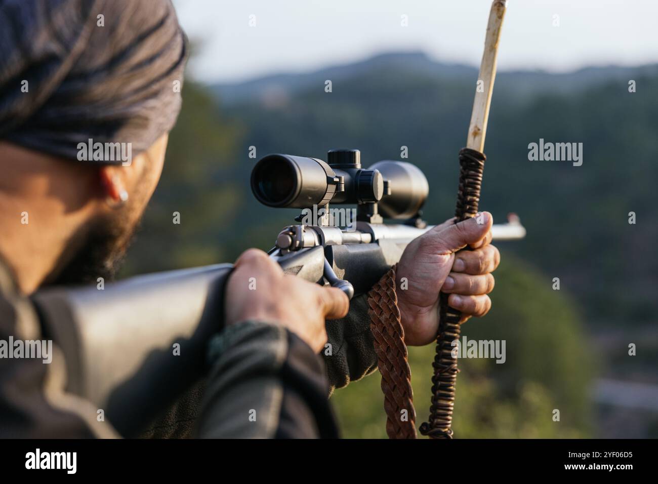 Hunter aiming with rifle in nature Stock Photo - Alamy