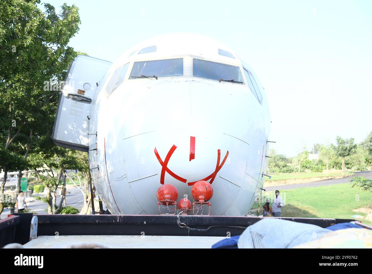 A cargo truck transports an obsolete passenger plane through motorway ...