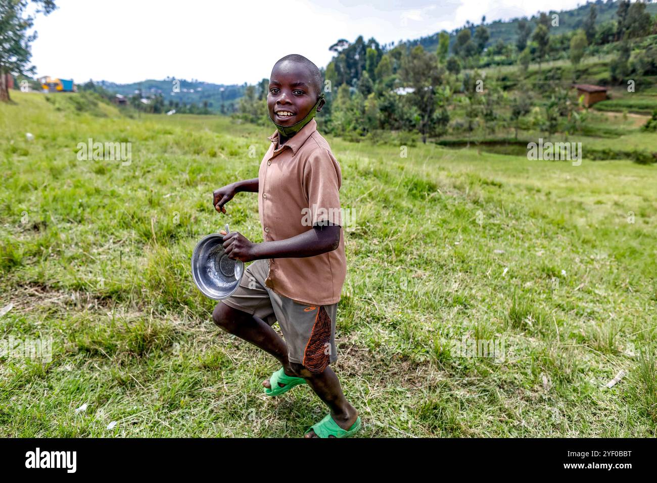 Schoolboy running, Rutsiro district, Rwanda Stock Photo - Alamy