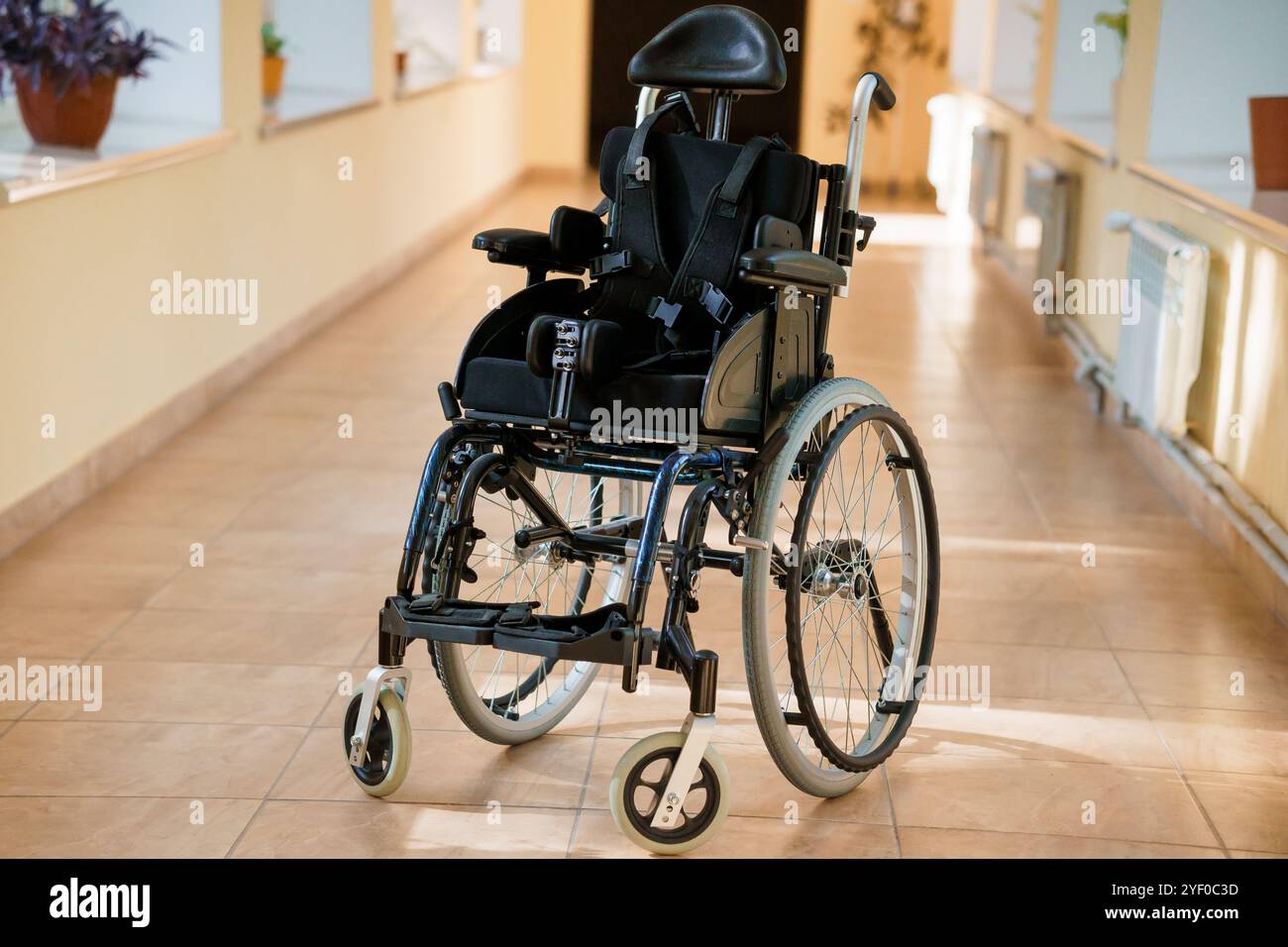 Modern Wheelchair in a Bright Corridor Stock Photo - Alamy