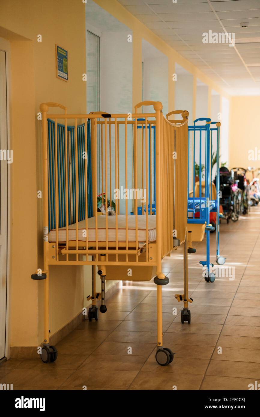 Pediatric Care Facility with Colorful Cribs in a Bright Corridor Stock ...