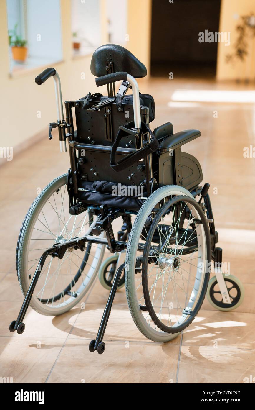Modern Lightweight Wheelchair in a Bright Hallway Stock Photo - Alamy