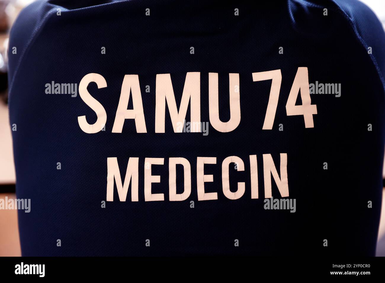 Close-up SAMU 74 marking written on the back of a vest worn by a doctor ... Close-up SAMU 74 marking written on the back of a vest worn by a doctor ...