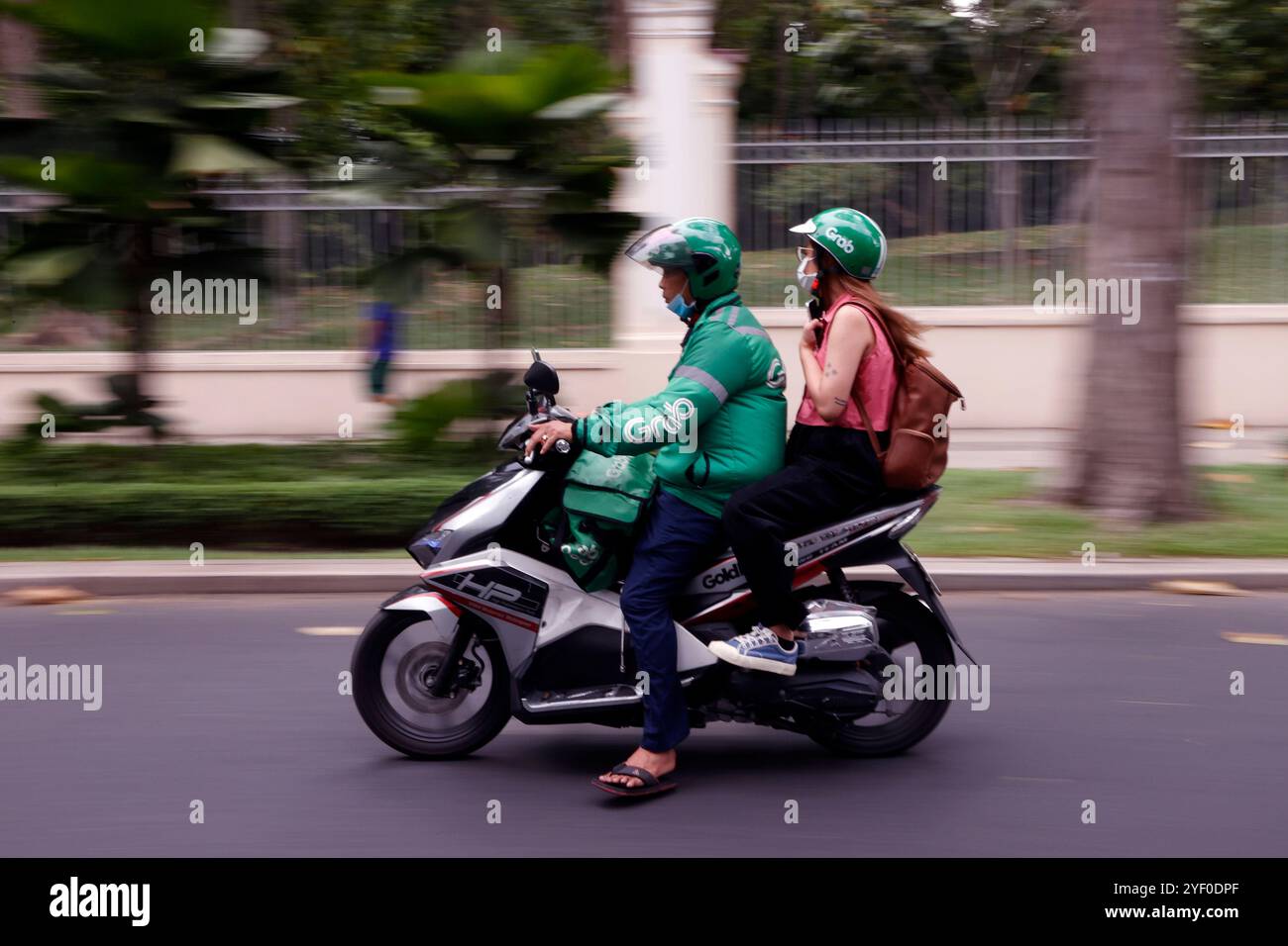Moto taxi grab driver hi-res stock photography and images - Alamy
