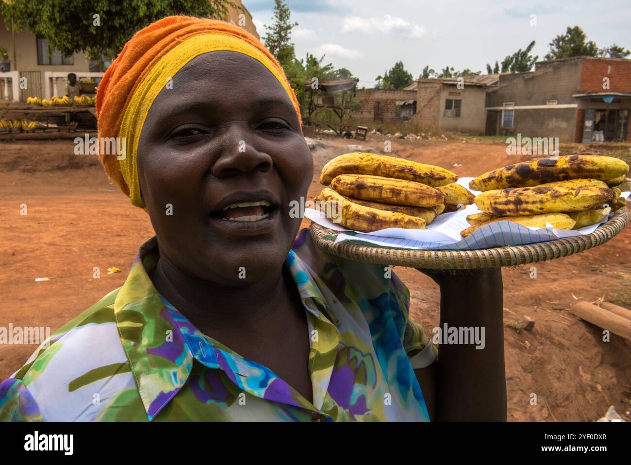 Woman selling fruit along the Kampala - Gulu road Stock Photo - Alamy